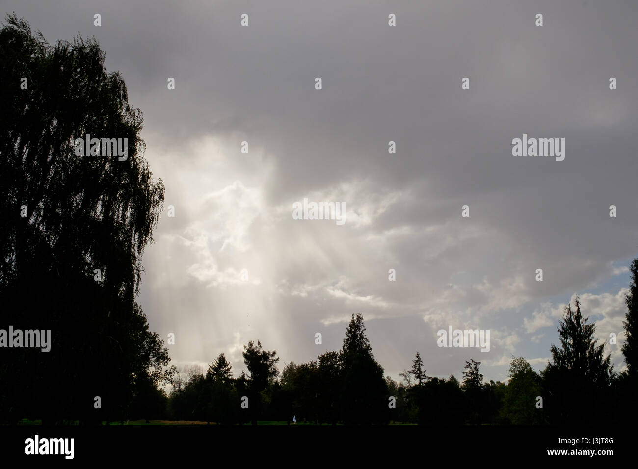 Clouds and Rain with Sunlight Stock Photo - Alamy