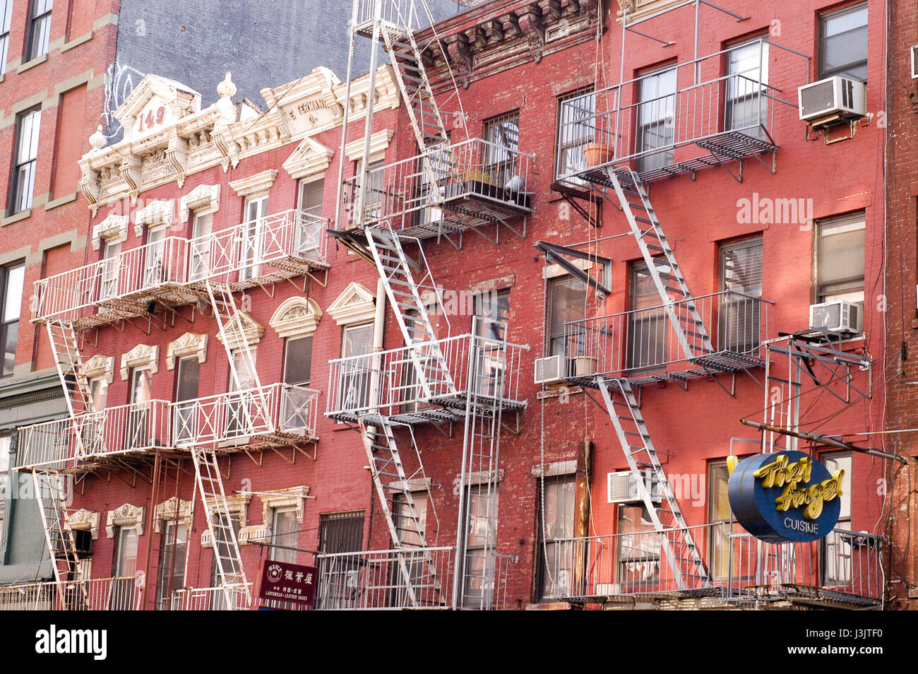 Red buildings with fire escapes in New York city Stock Photo - Alamy
