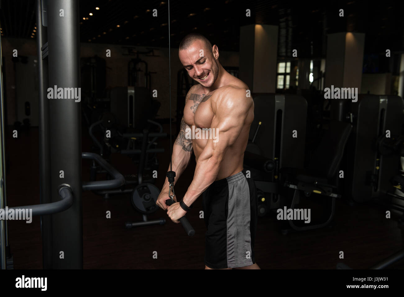 Handsome Muscular Fitness Bodybuilder Doing Heavy Weight Exercise For ...