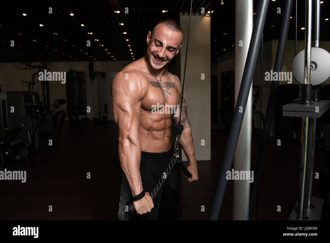 Handsome Muscular Fitness Bodybuilder Doing Heavy Weight Exercise For ...