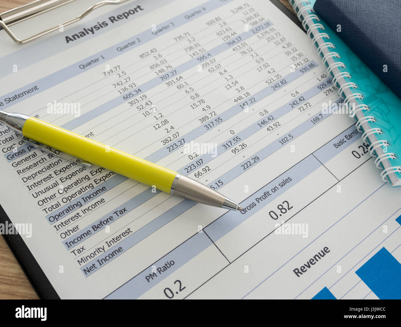 Marketer's desk with analysis Report ,pen,notebook Stock Photo - Alamy