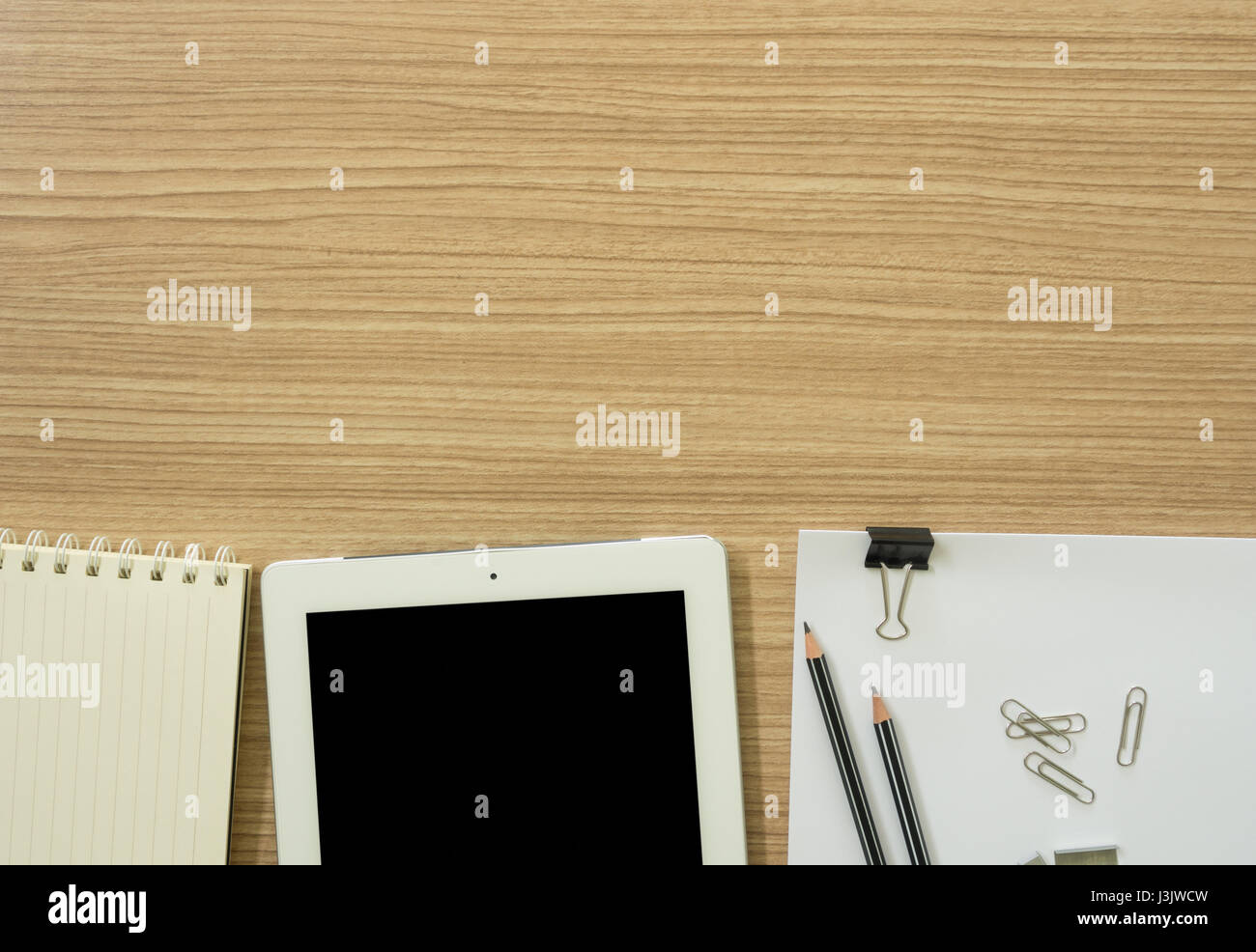 work desk with computer tablet and notebook. View from above Stock ...