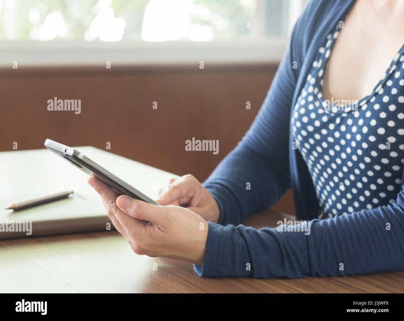 closeup woman using smart phone at home Stock Photo - Alamy
