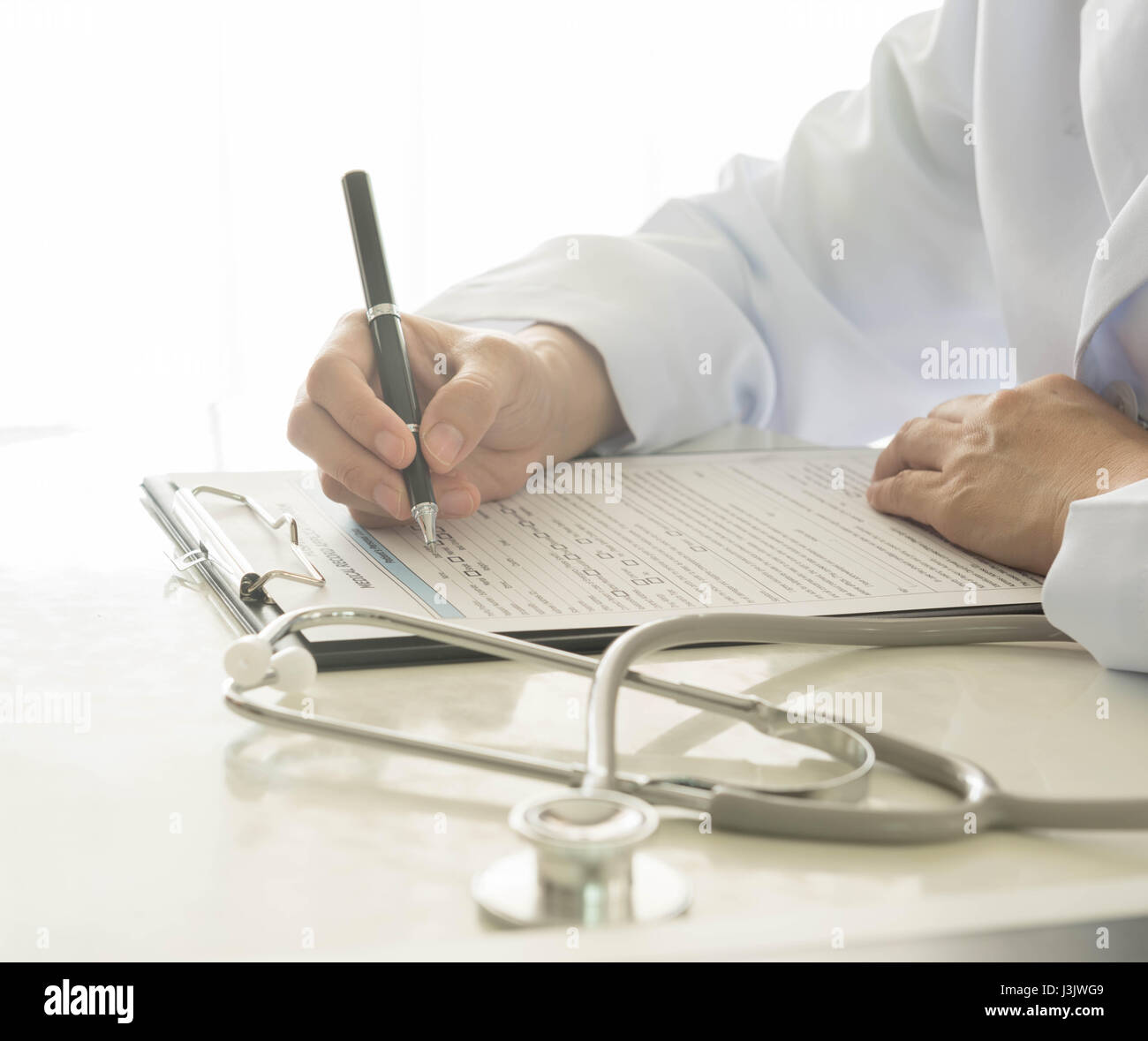 close-up of doctor taking notes on hospital Stock Photo - Alamy