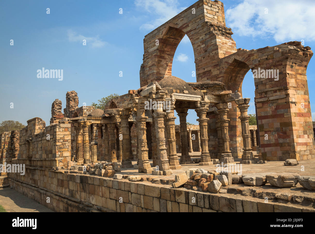 Medieval historic ruins at the Qutb Minar site in Delhi form the Qutb ...