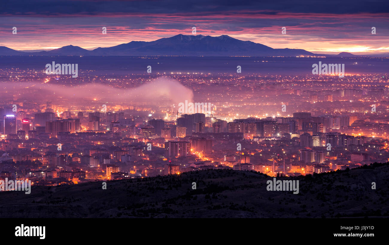 Cityscape under smoke during sunset Stock Photo - Alamy