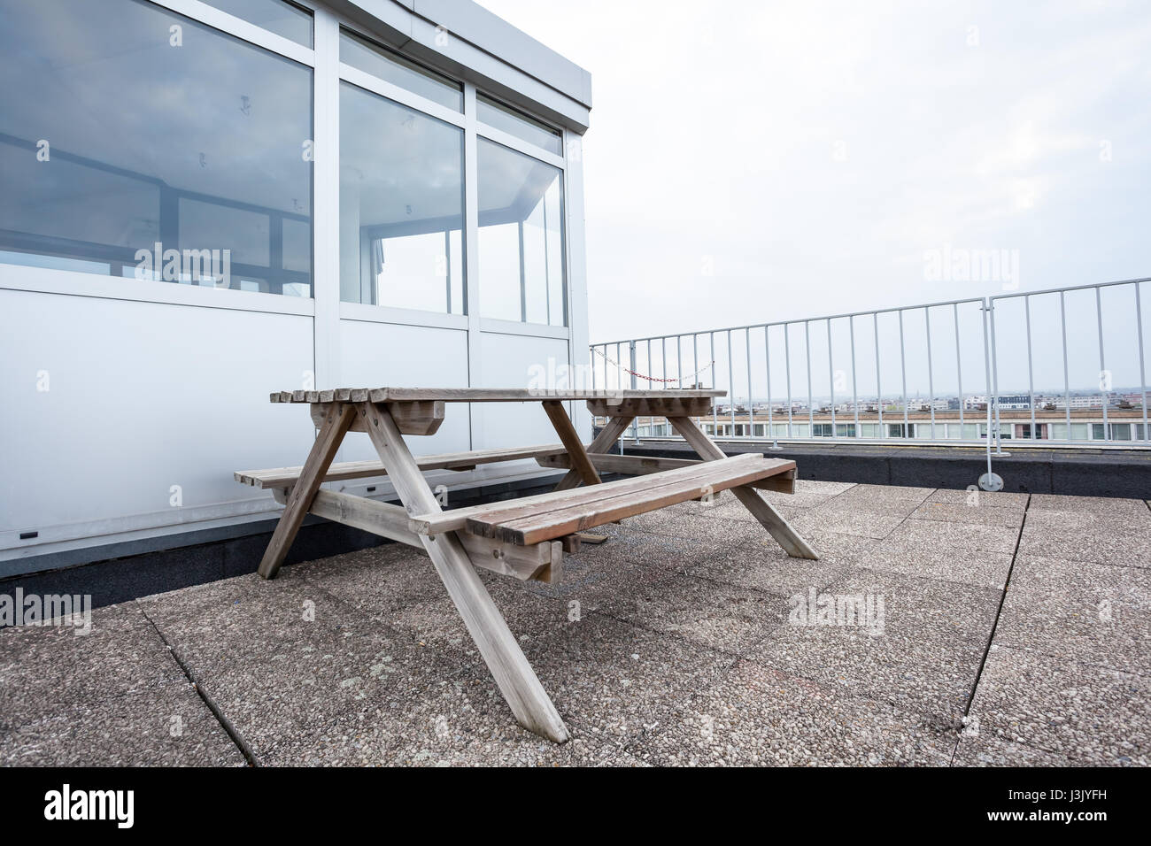 On a tall building in the city there is a large roof terrace Stock ...