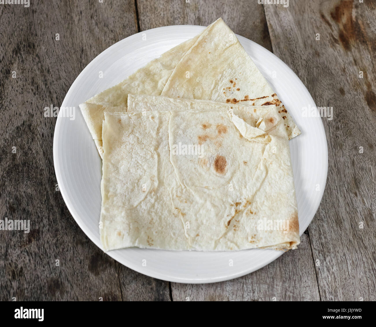 Armenian flatbread lavash on wooden table Stock Photo - Alamy