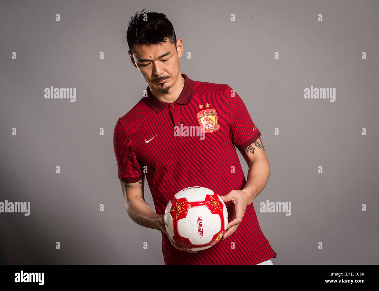 Portrait of Chinese soccer player Zeng Cheng of Guangzhou Evergrande ...