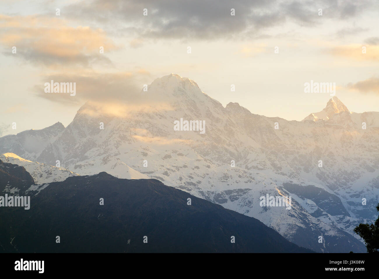 Chaukhamba peaks during sunrise from Deoria Tal lake, India Stock Photo ...