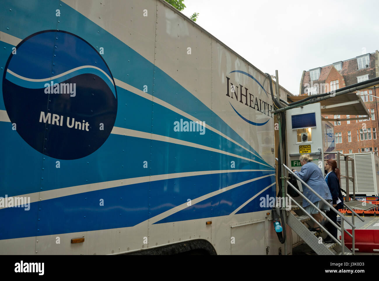Elderly patient entering mobile MRI unit for a Magnetic Resonance ...