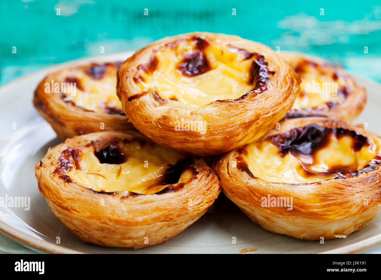 Egg tart, traditional Portuguese dessert, pastel de nata on a plate ...
