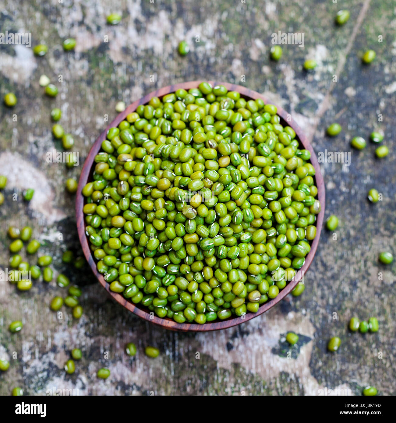 Mung bean, green moong dal in wooden bowl. Copy space. Grey background ...