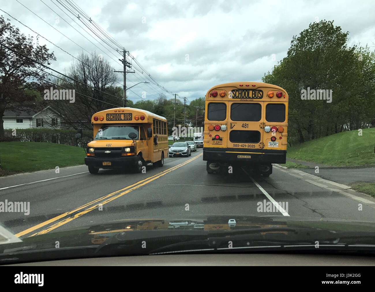 School buses in passing Stock Photo - Alamy