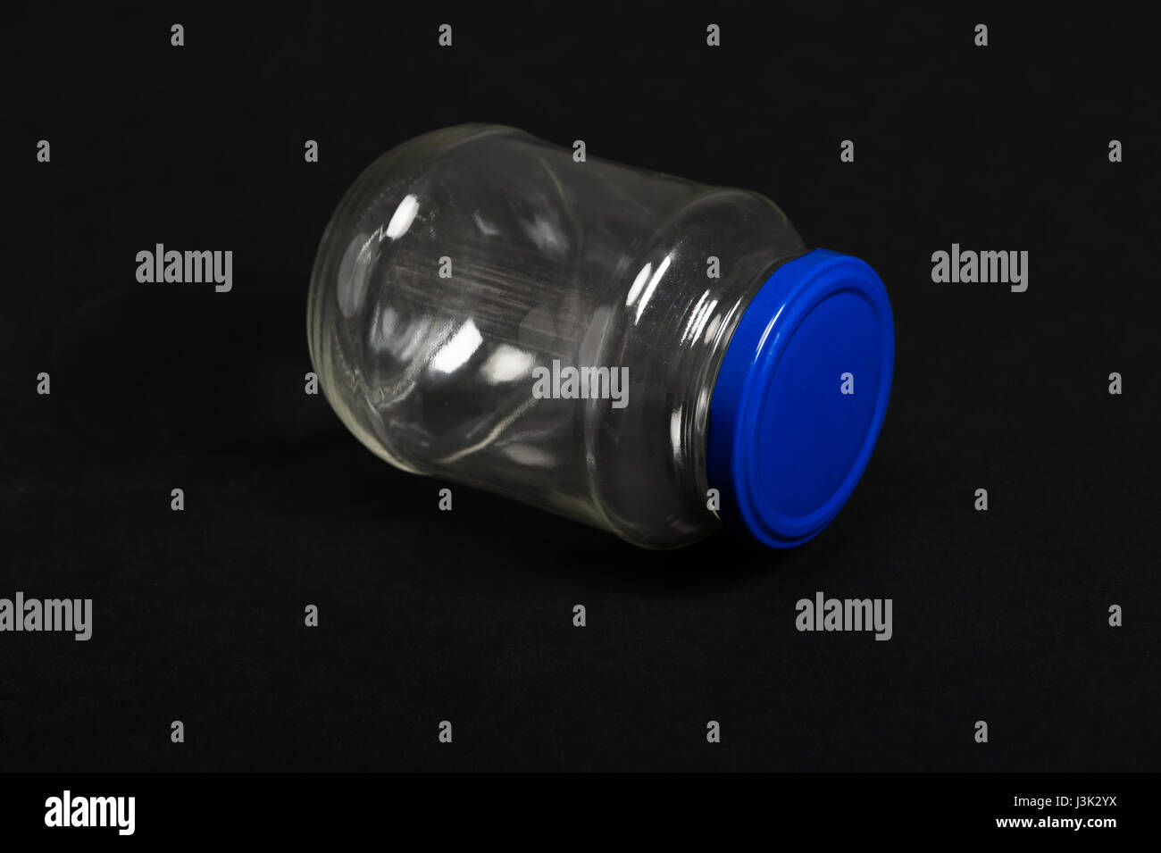 Empty glass jar on the back background Stock Photo - Alamy