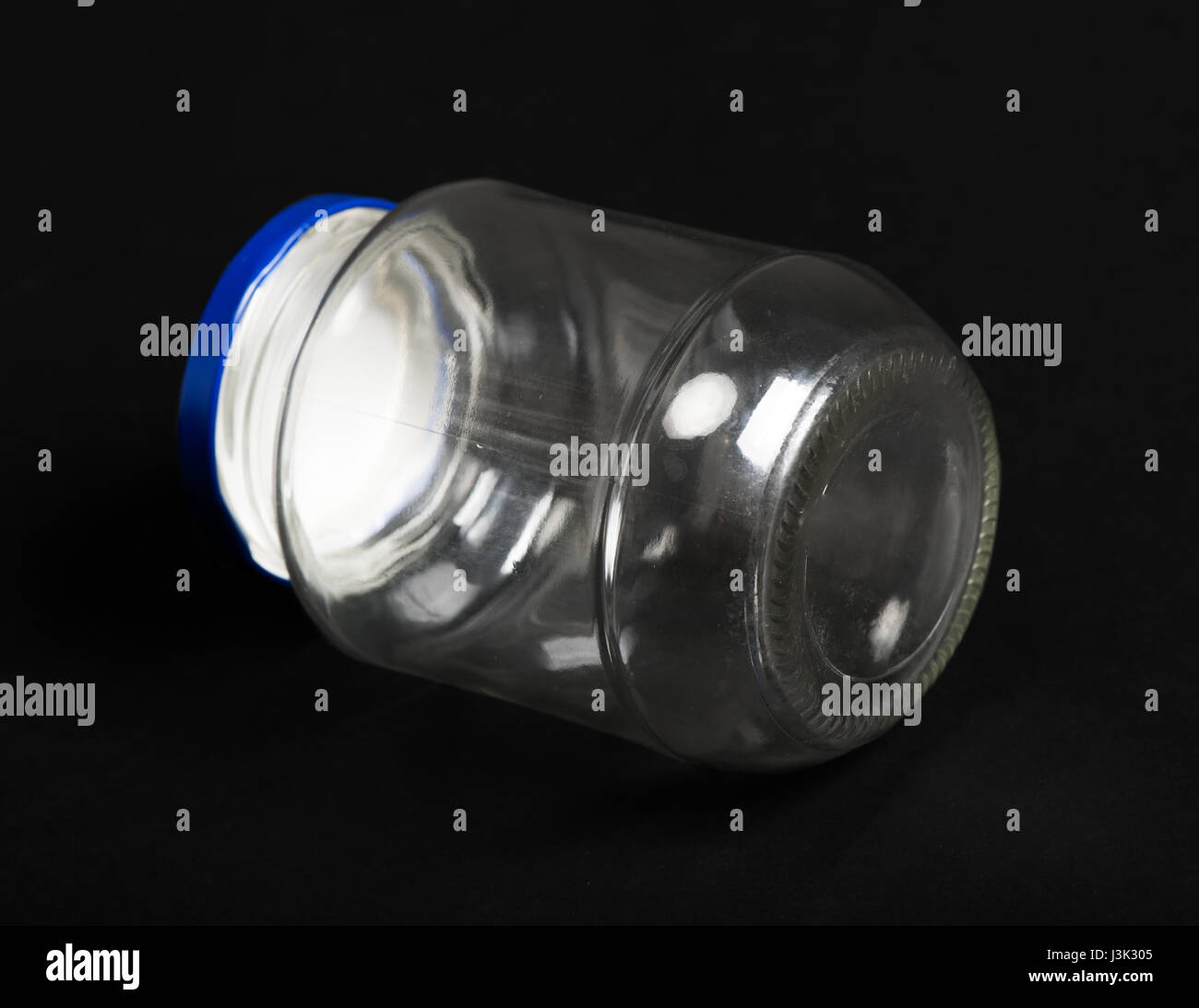 Empty glass jar on the back background Stock Photo - Alamy