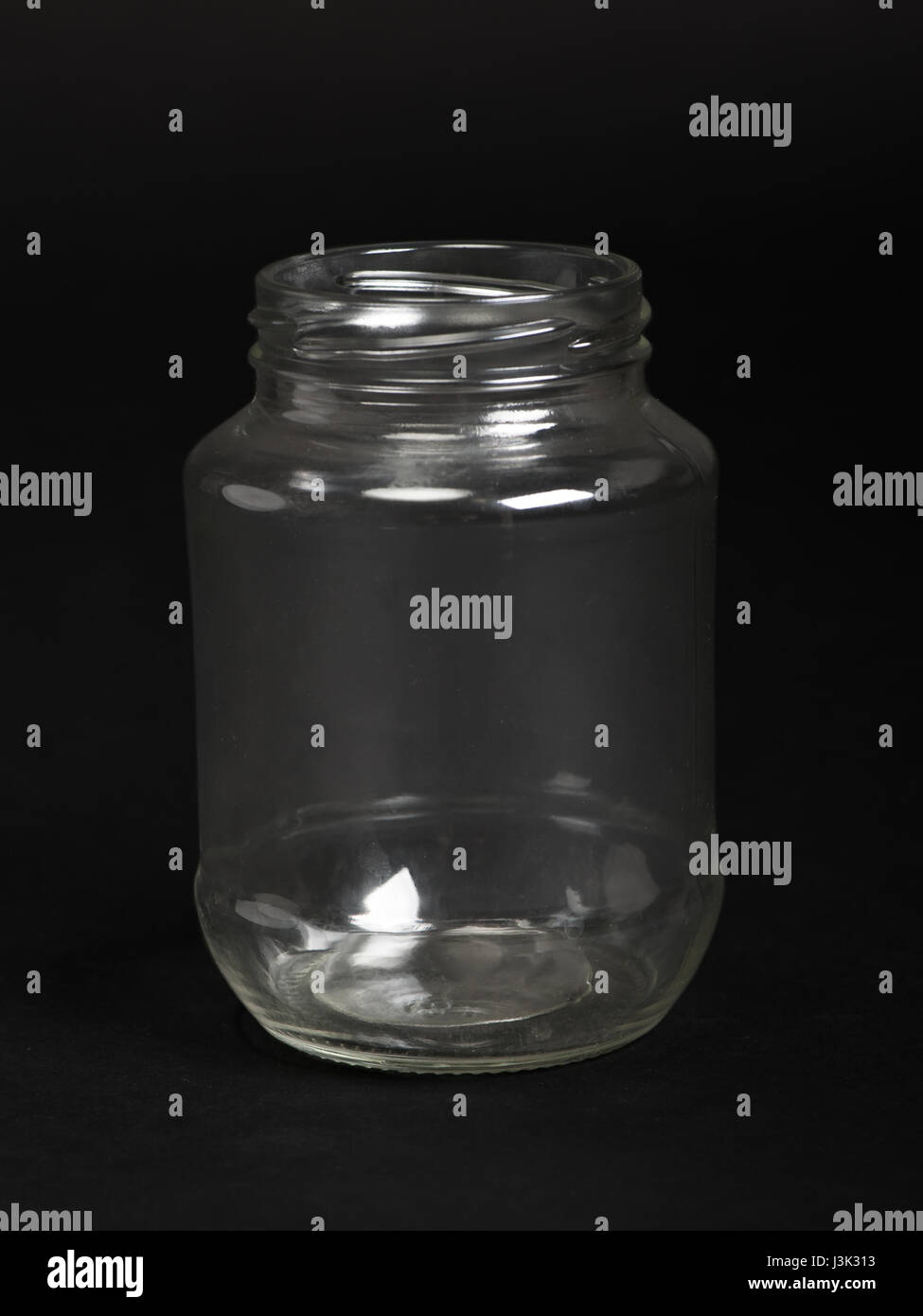 Empty glass jar on the back background Stock Photo - Alamy