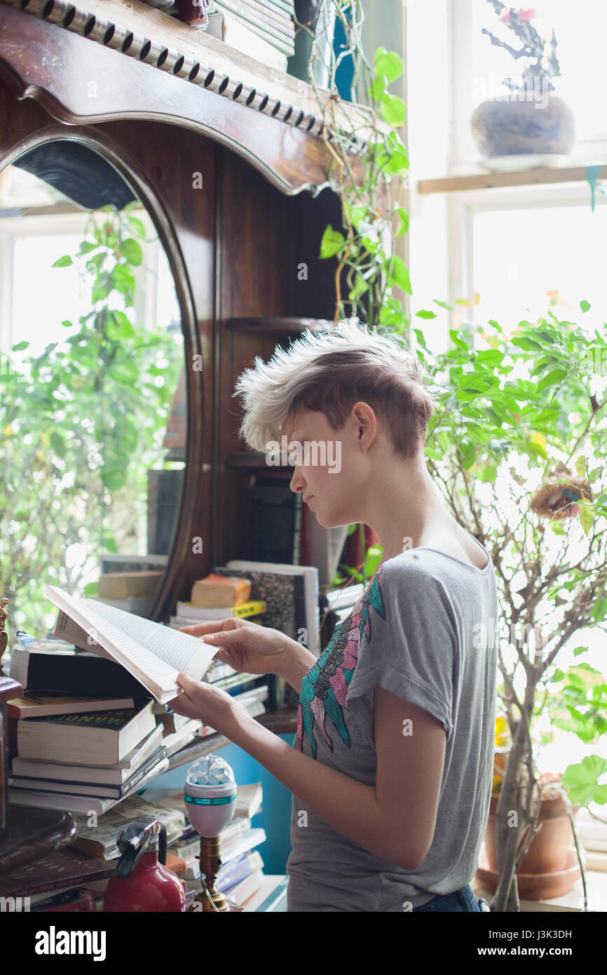 Young woman hanging out in her apartment Stock Photo - Alamy