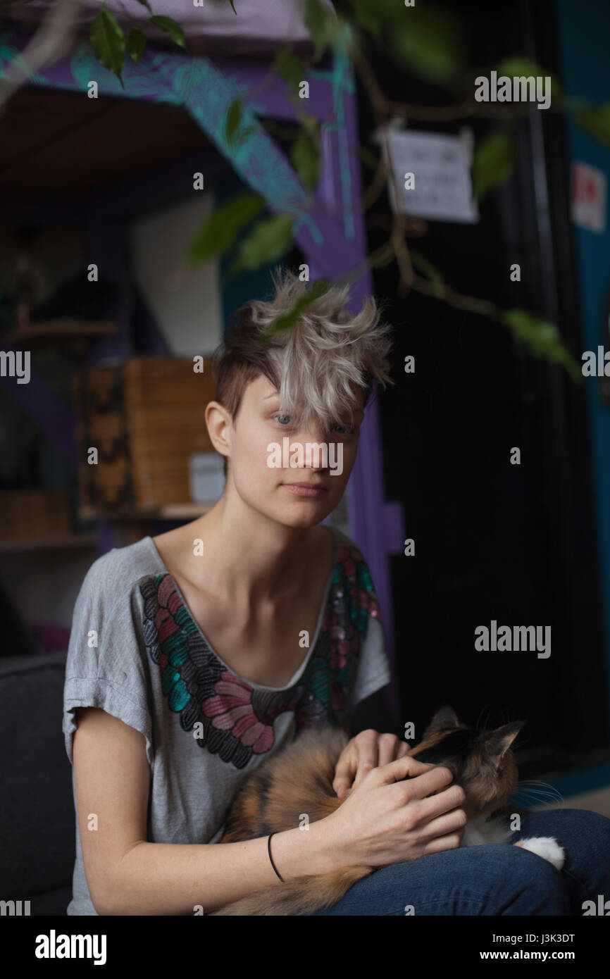 Young woman hanging out in her apartment Stock Photo - Alamy