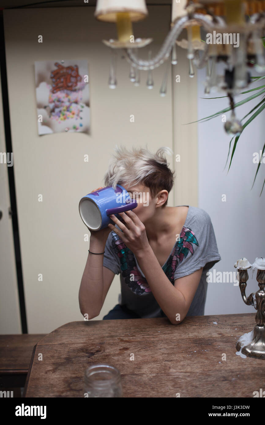 Young woman hanging out in her apartment Stock Photo - Alamy