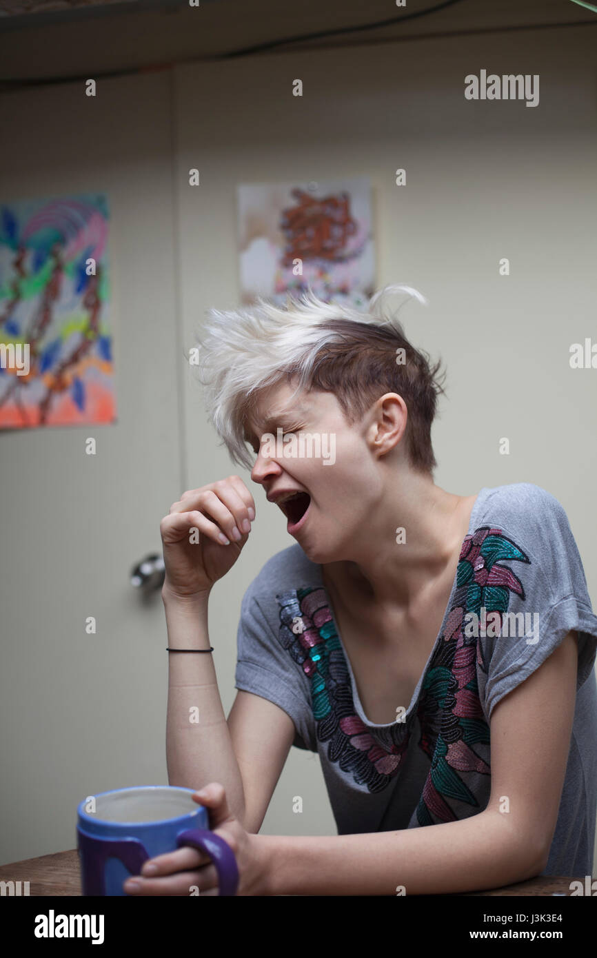 Young woman hanging out in her apartment Stock Photo - Alamy