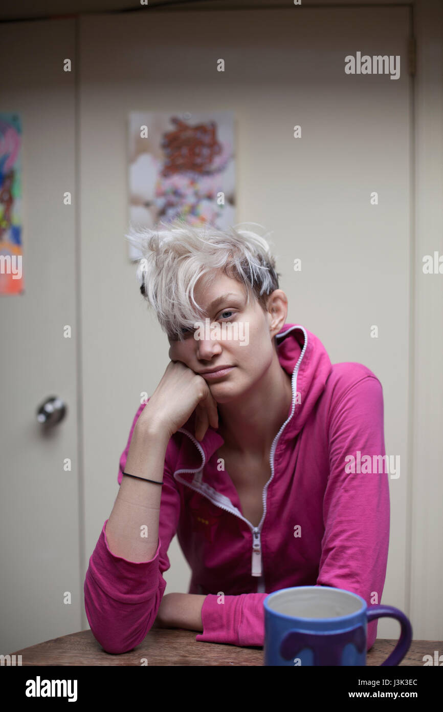 Young woman hanging out in her apartment Stock Photo - Alamy