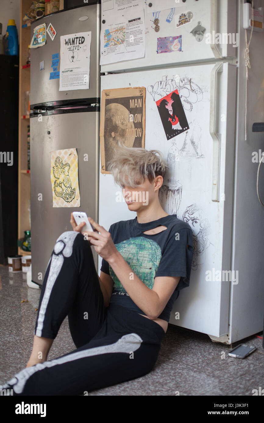 Young woman hanging out in her apartment Stock Photo - Alamy
