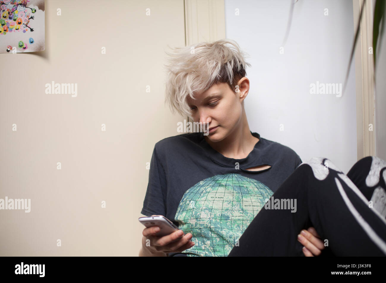 Young woman hanging out in her apartment Stock Photo - Alamy