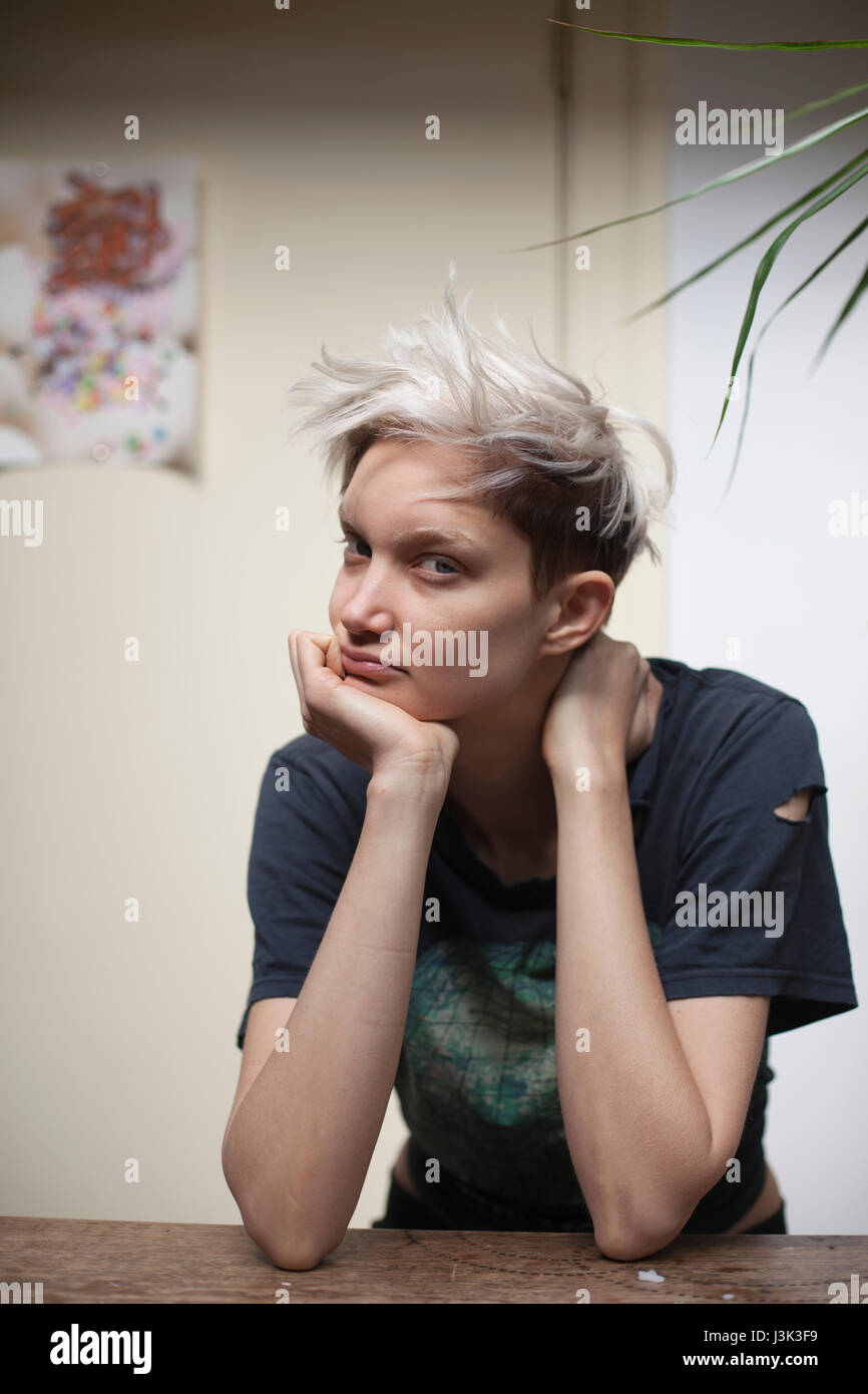 Young woman hanging out in her apartment Stock Photo - Alamy