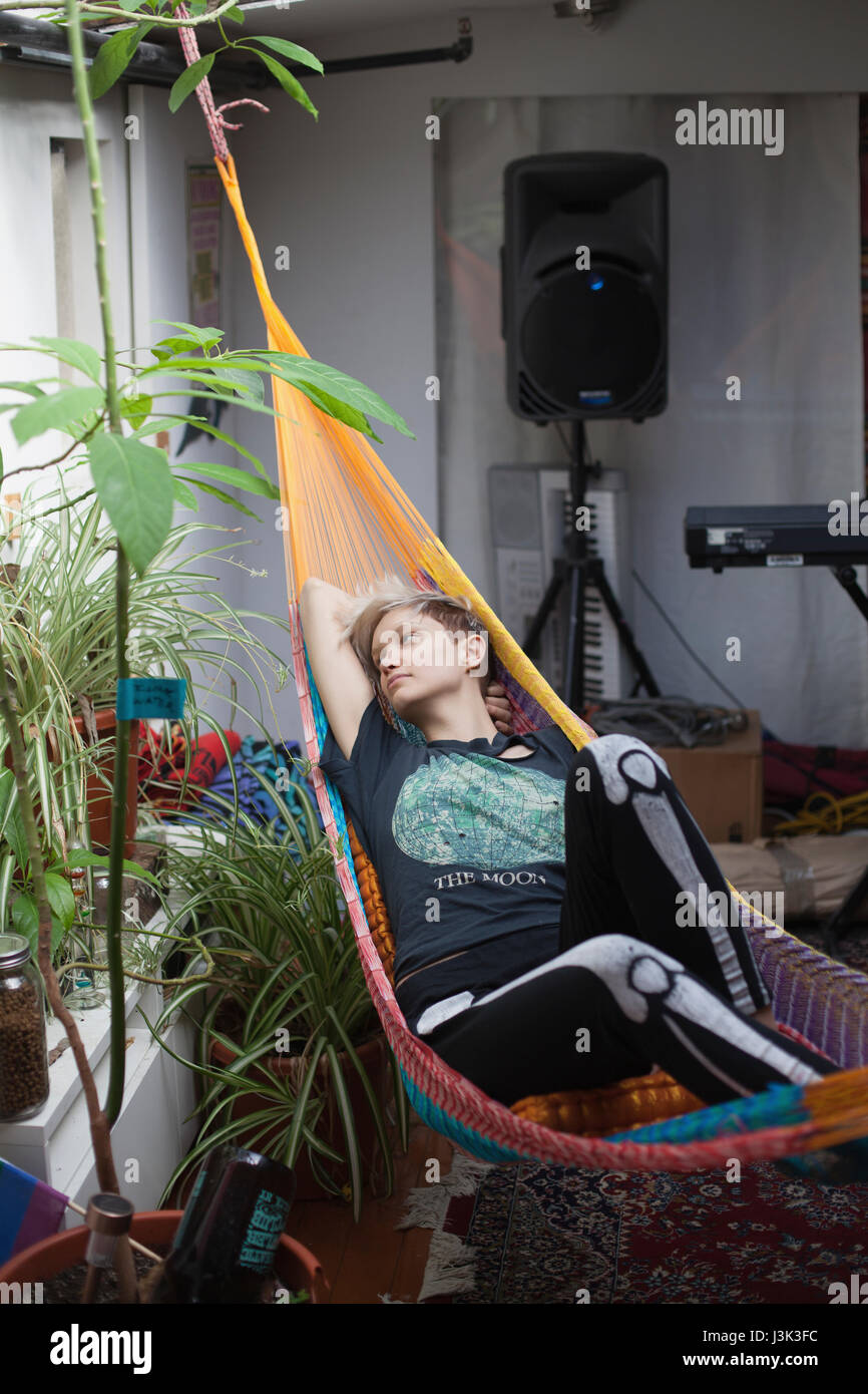 Young woman hanging out in her apartment Stock Photo - Alamy