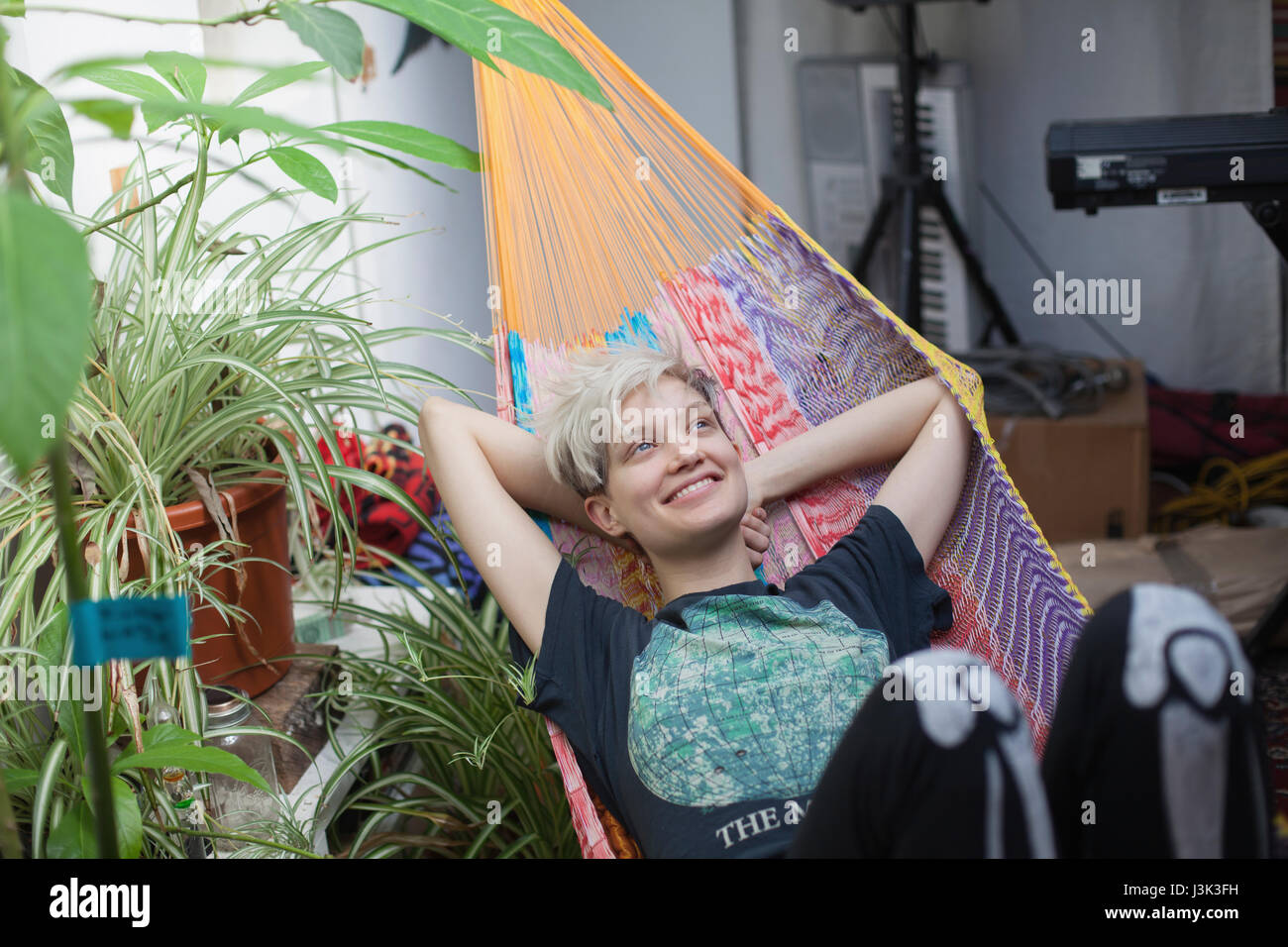 Young woman hanging out in her apartment Stock Photo - Alamy