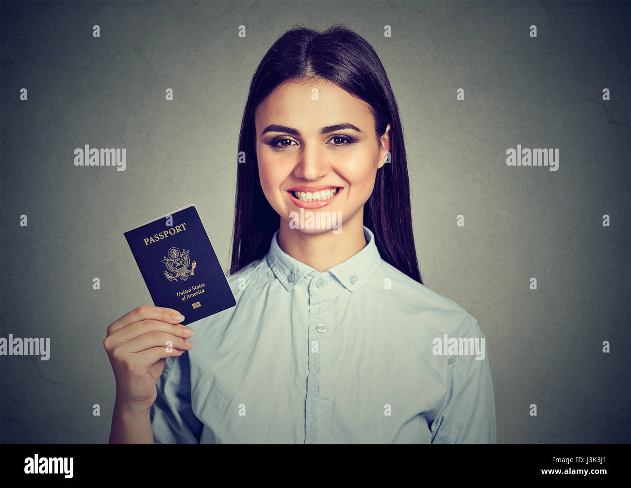 Portrait attractive young happy woman with USA passport isolated on ...