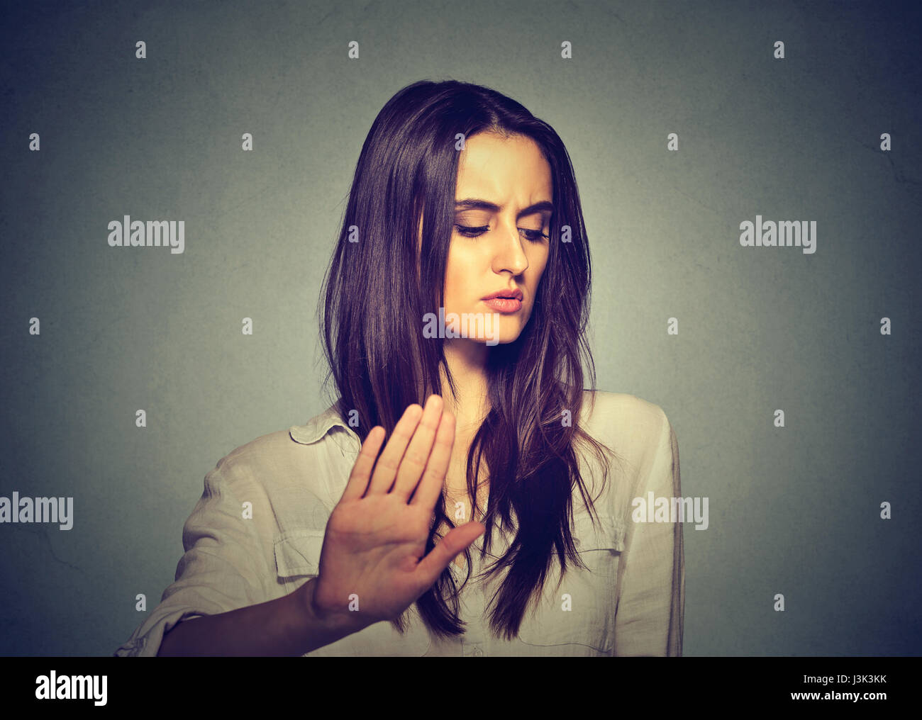 Upset angry woman giving talk to hand gesture with palm outward ...