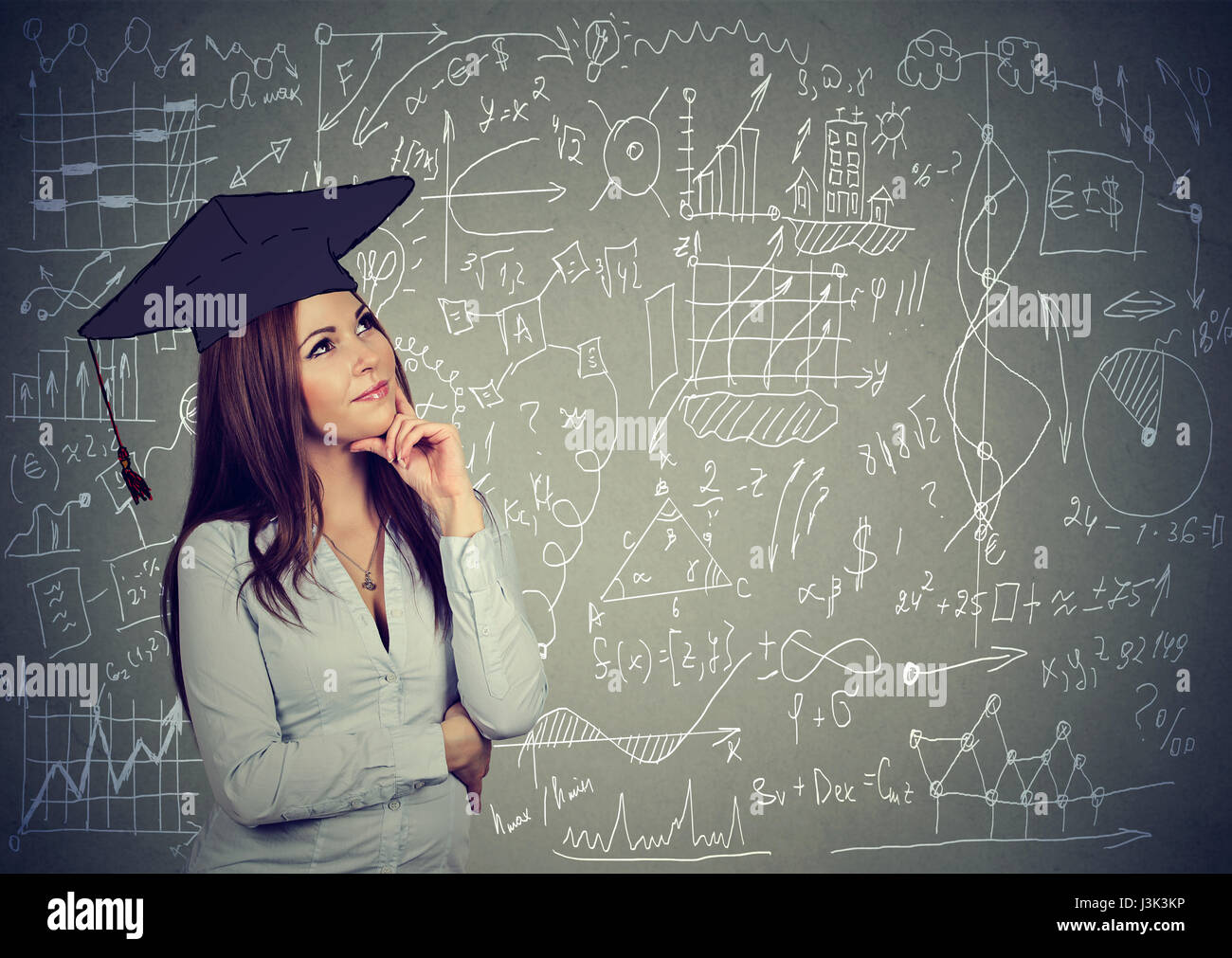 Young woman in graduation cap thinking about education, work life ...