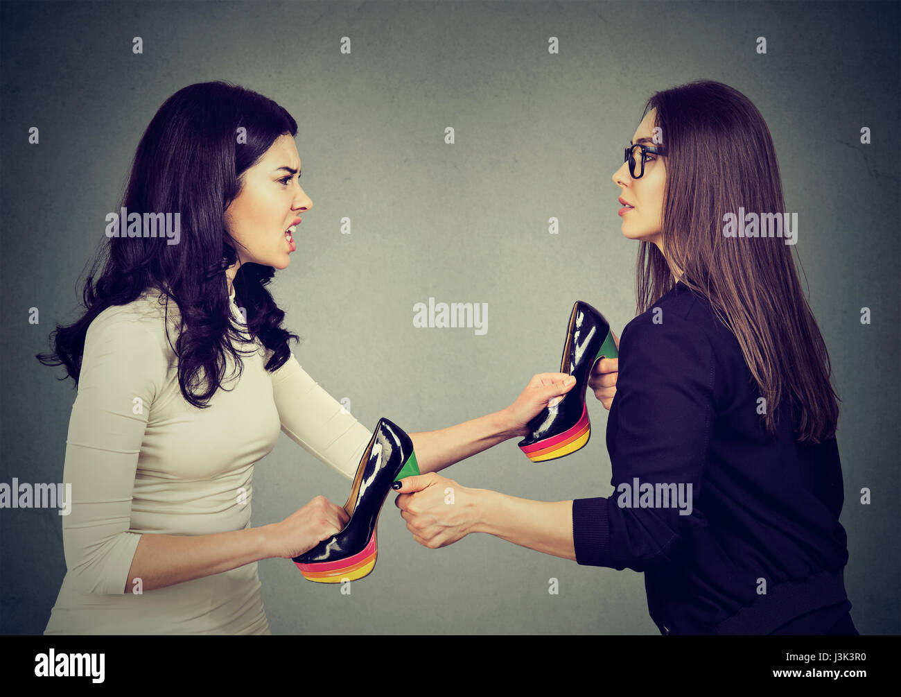 Two jealous women fighting hi-res stock photography and images - Alamy