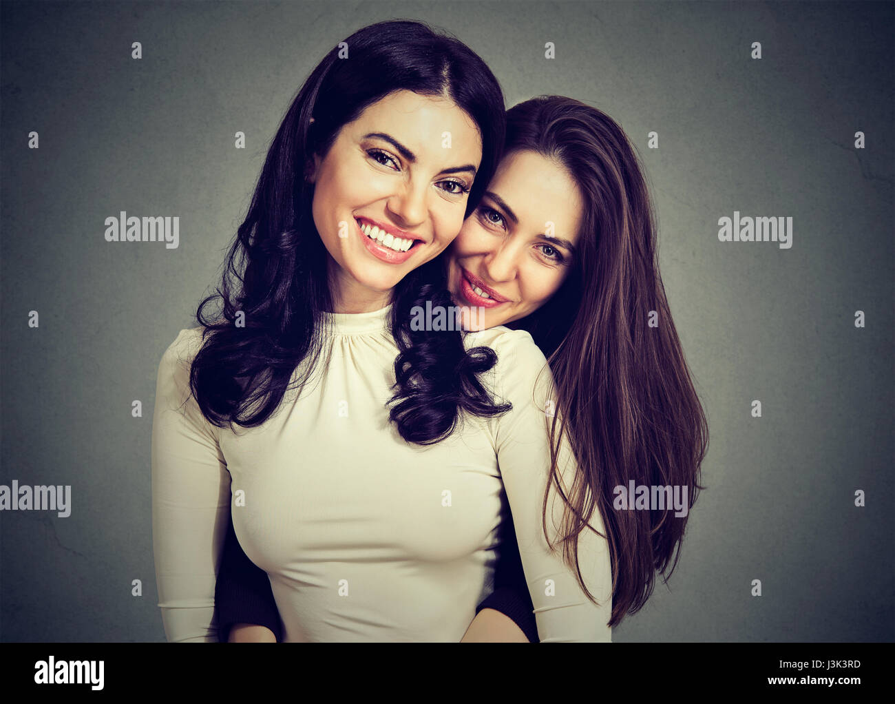 Beautiful girlfriends two best friends embrace hug each other Stock ...