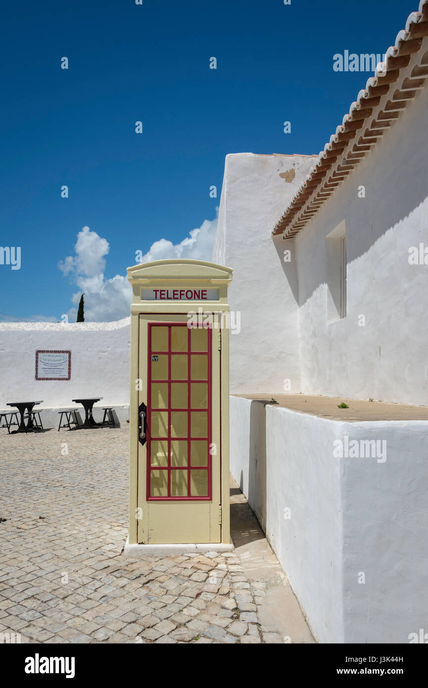 cream coloured telephone box in the village square of Cacela Velha in ...