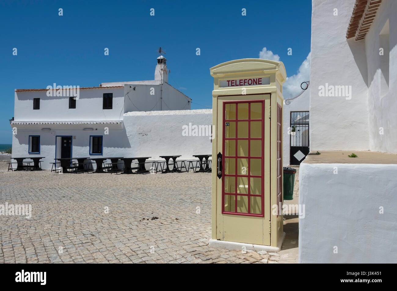 cream coloured telephone box in the village square of Cacela Velha in ...