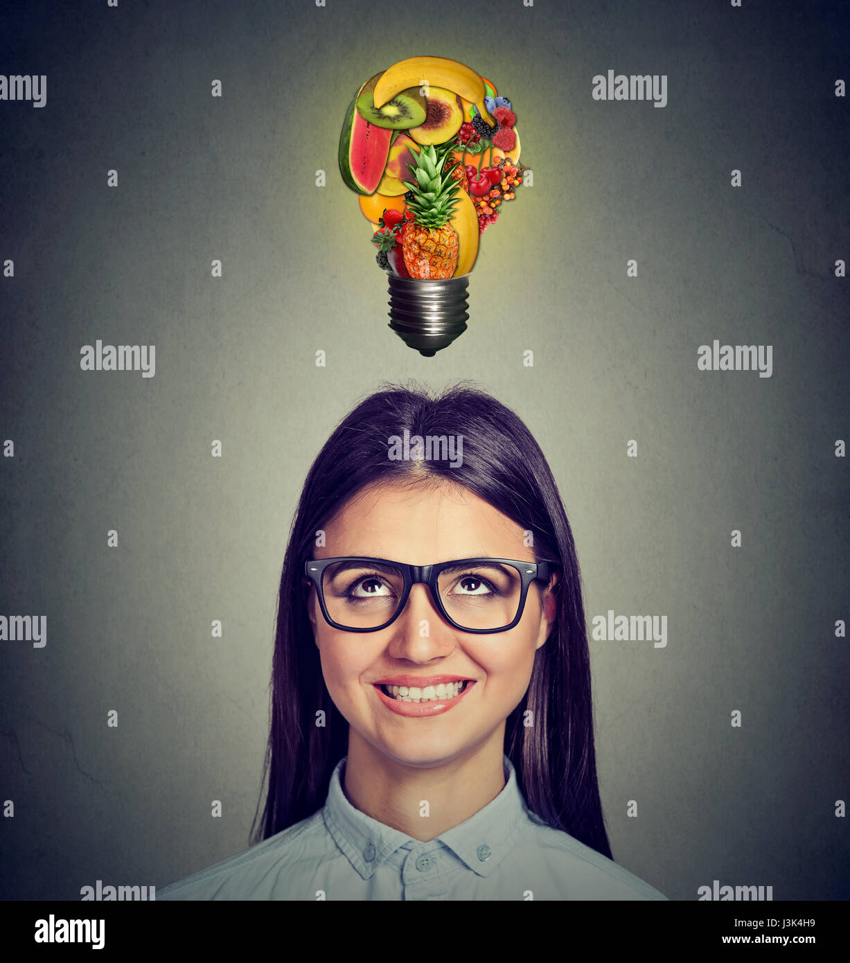 Eating healthy diet tips concept. Headshot of a woman looking up at ...