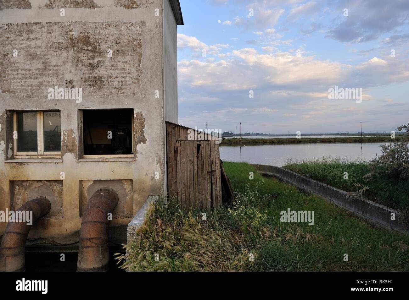 San Michele tower and the old salt deposit and Salt Museum, salt flats ...