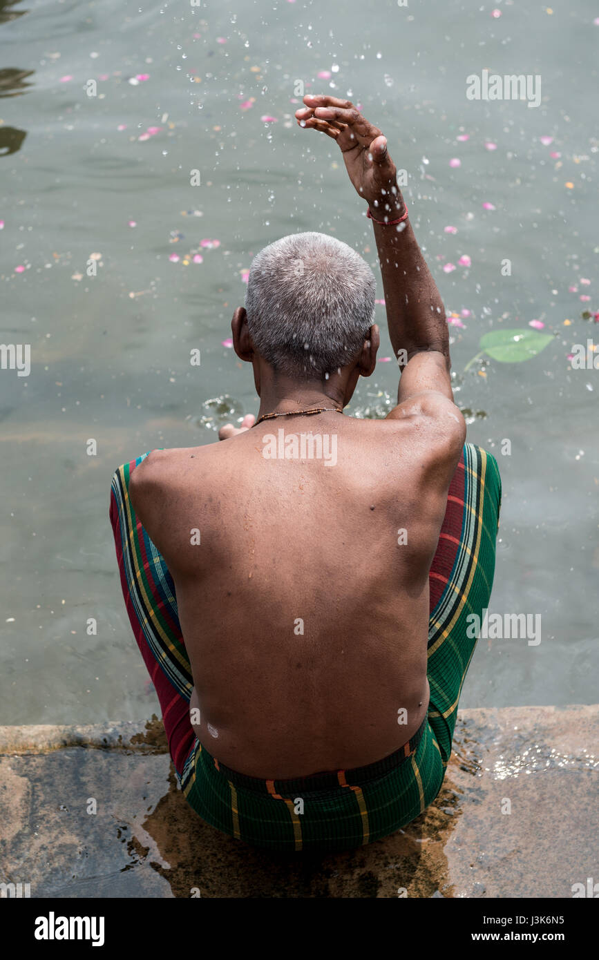Hindu man bathing at Ganges River Stock Photo - Alamy