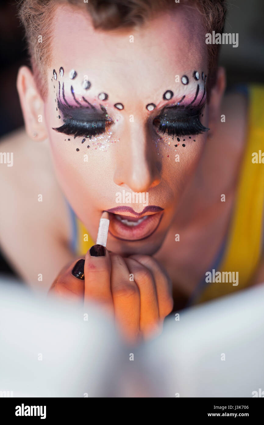 Young man applying drag makeup Stock Photo - Alamy