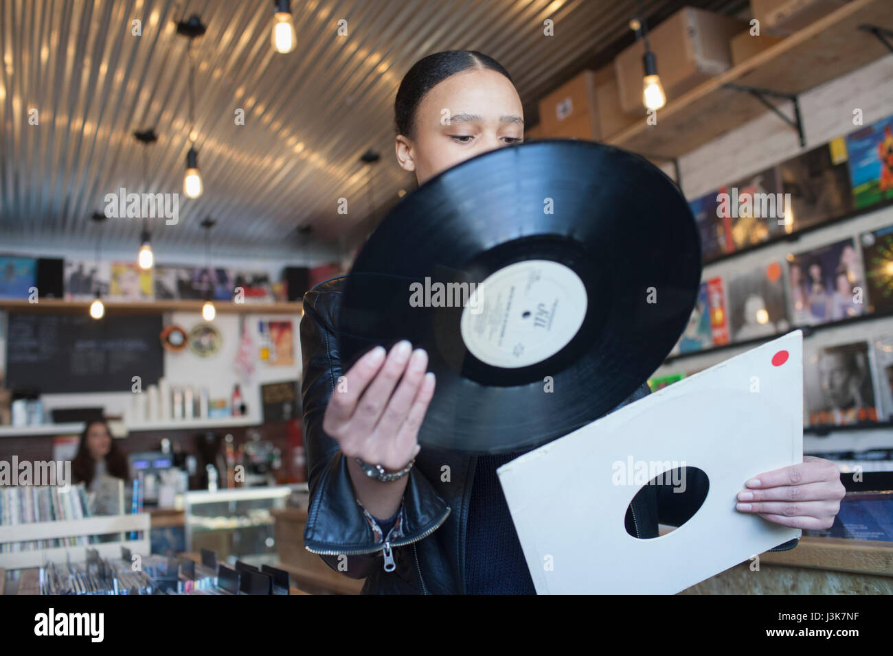 Young woman in a record store Stock Photo - Alamy