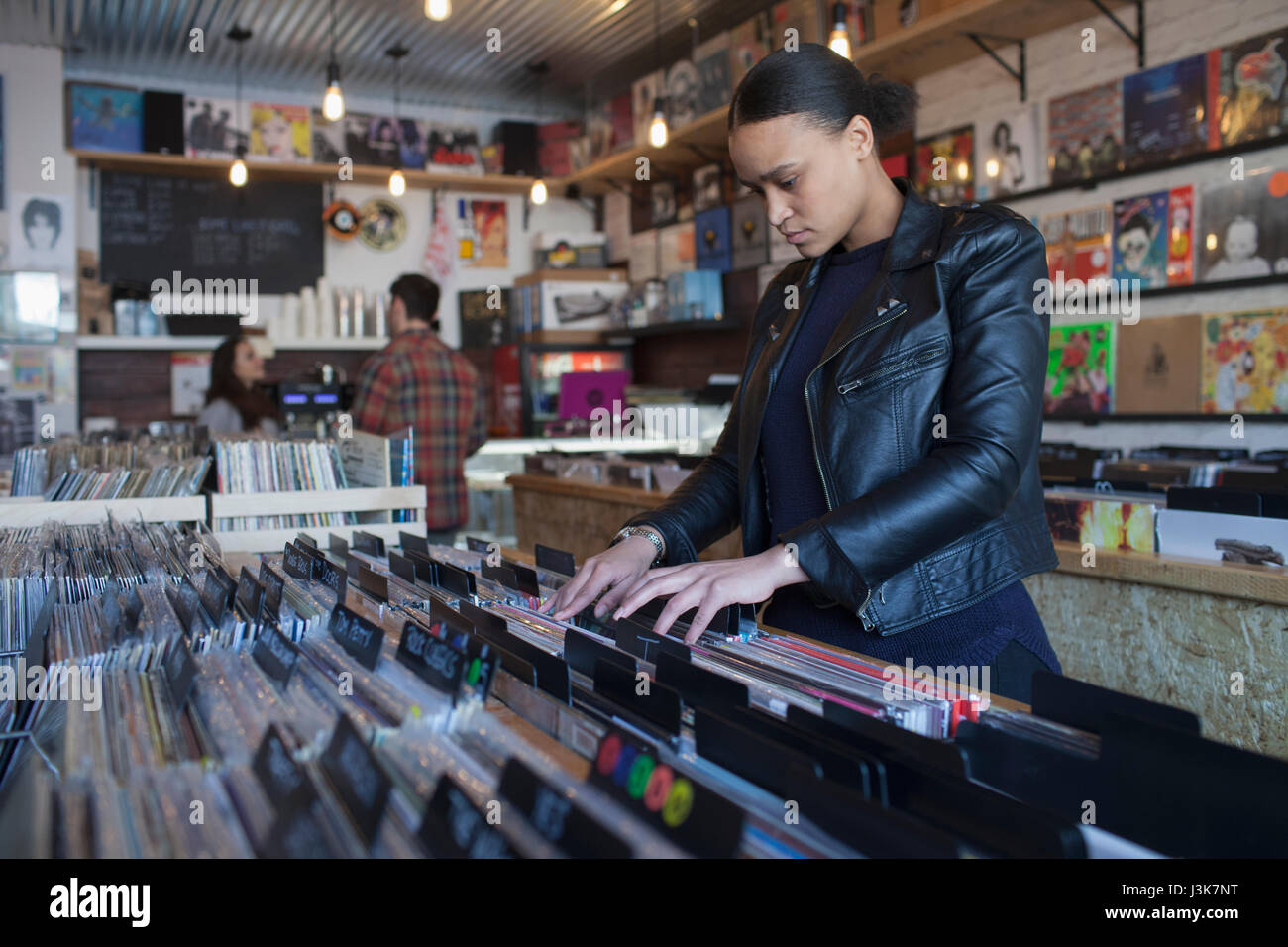 Young woman in a record store Stock Photo - Alamy