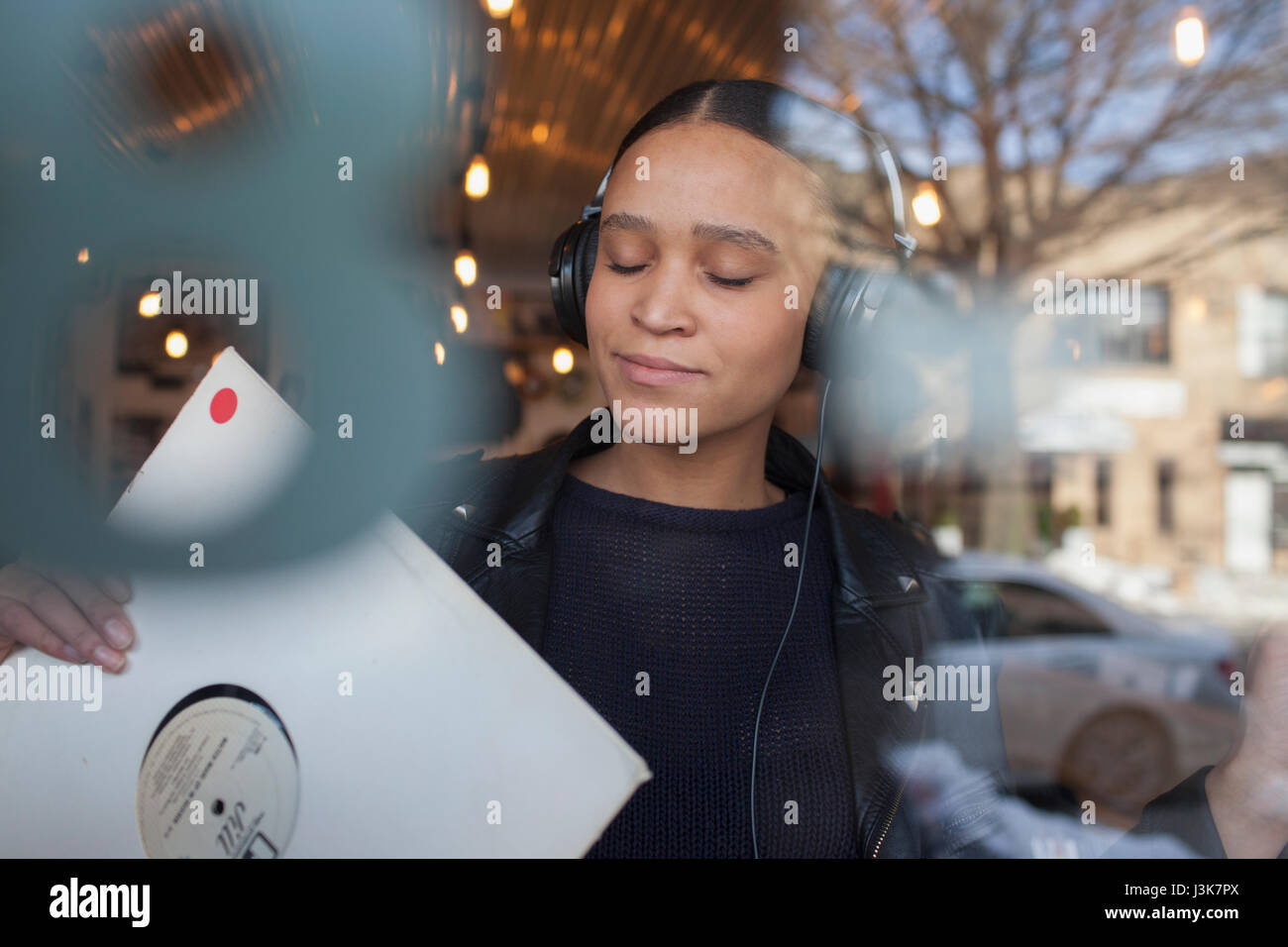 Young woman in a record store Stock Photo - Alamy