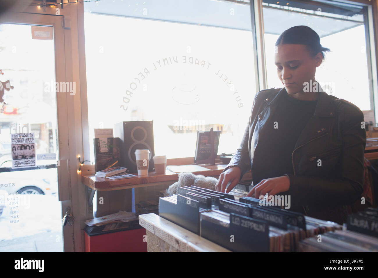 Young woman in a record store Stock Photo - Alamy