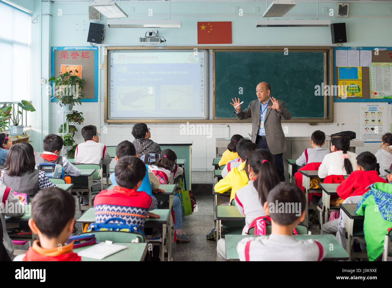 Chengdu, Sichuan Province, China - March 31, 2017: Teacher giving a ...
