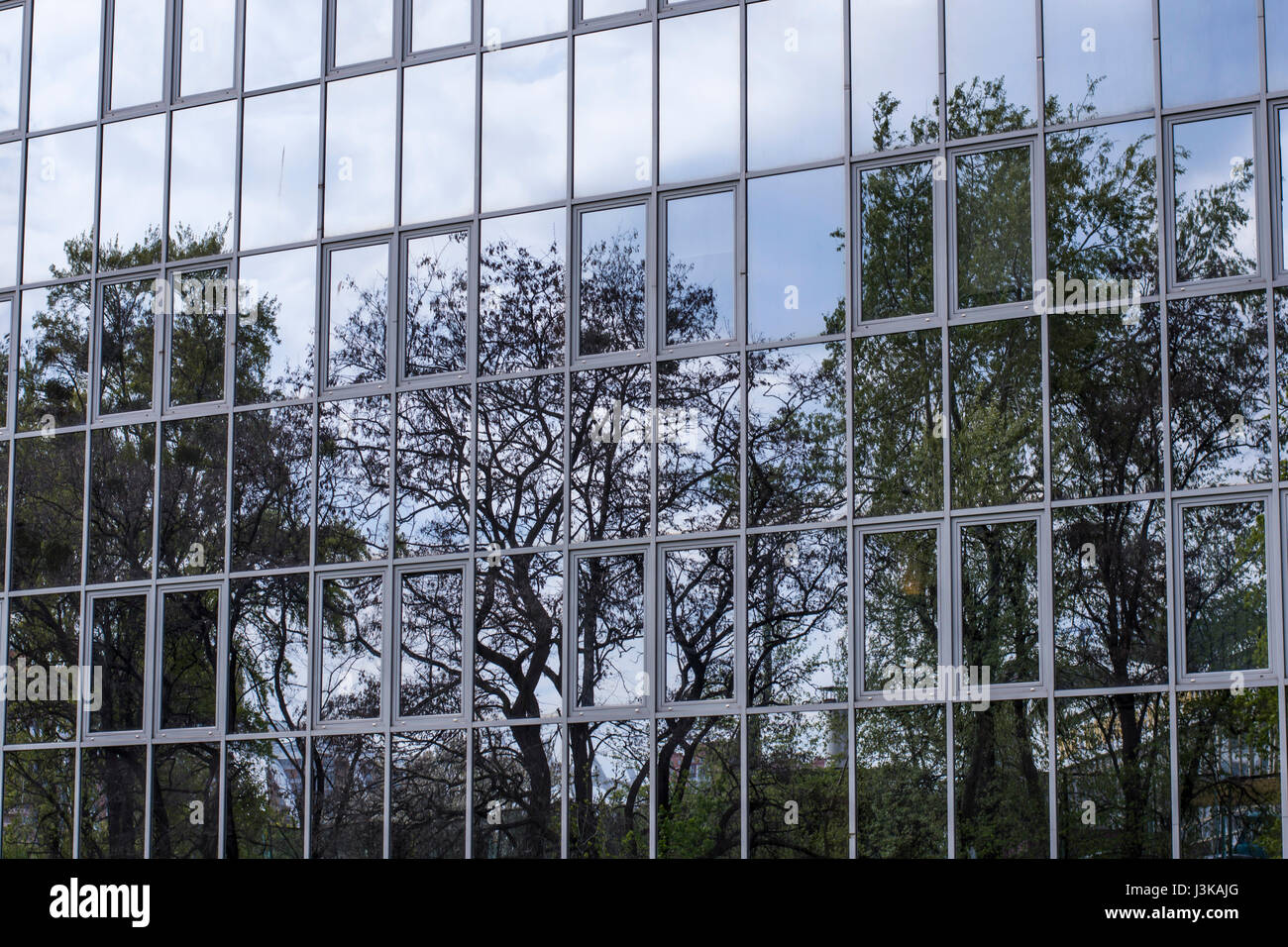Modern Glass Building Reflecting Nature Scene Stock Photo - Alamy