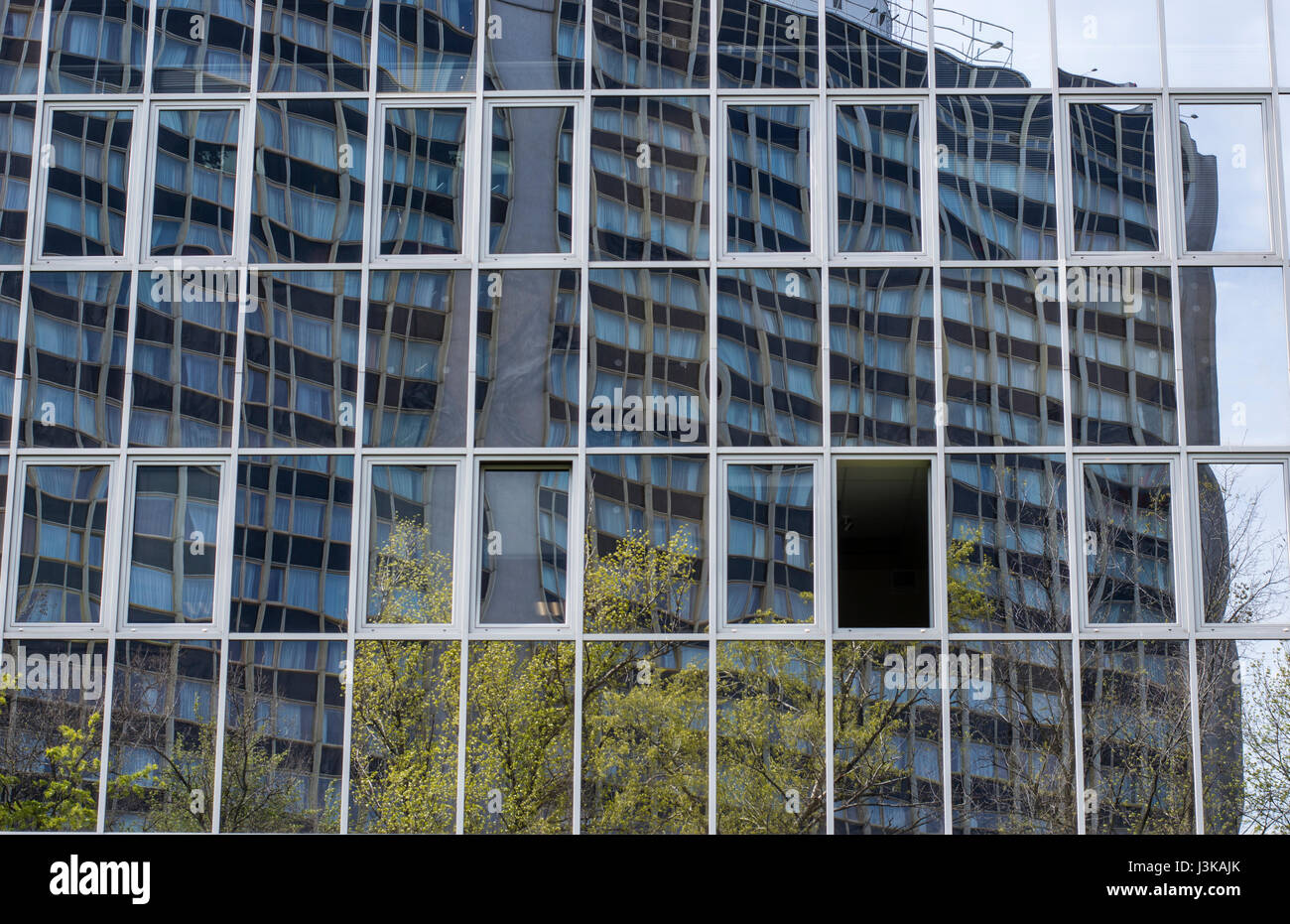 Modern glass building reflecting another multi storey building Stock ...