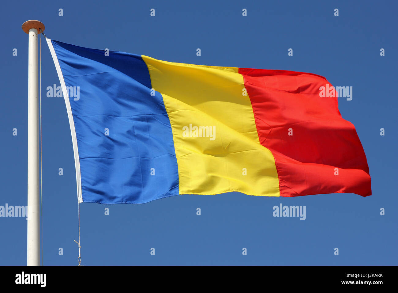 Romanian flag flying in the wind Stock Photo - Alamy